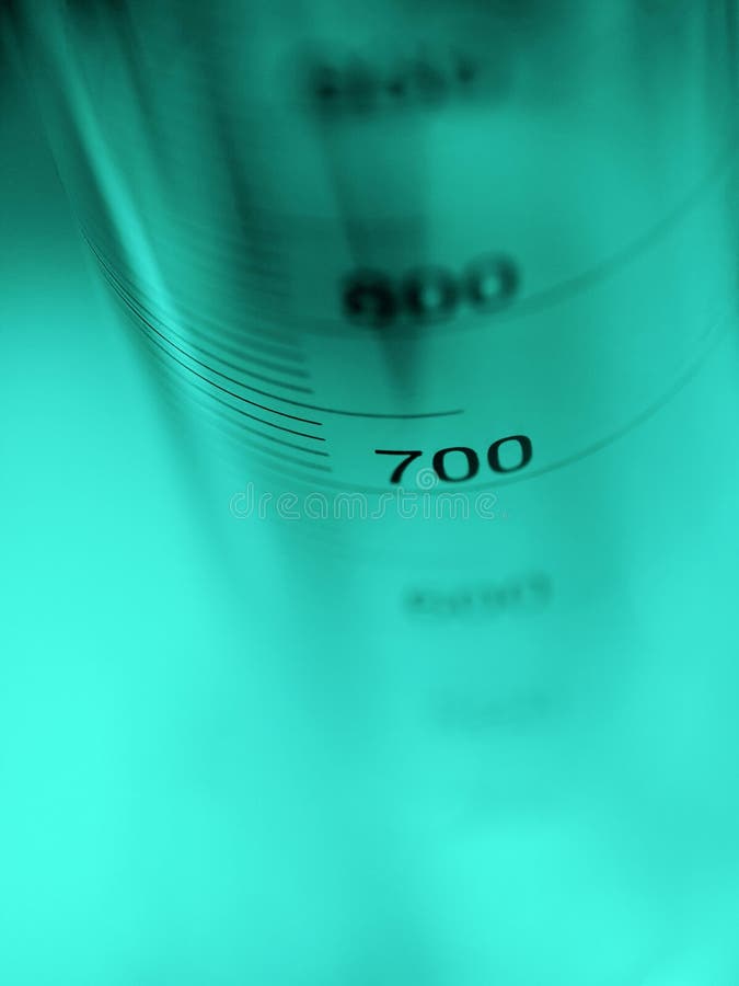 Graduated Cylinder in Green Stock Photo - Image of laboratory, medical ...