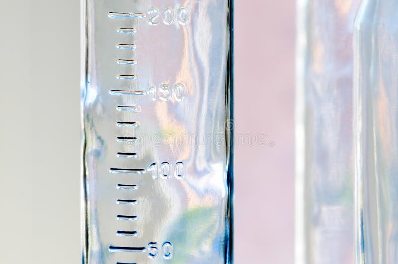 Graduated Glass Bottle stock photo. Image of quantity - 33555142