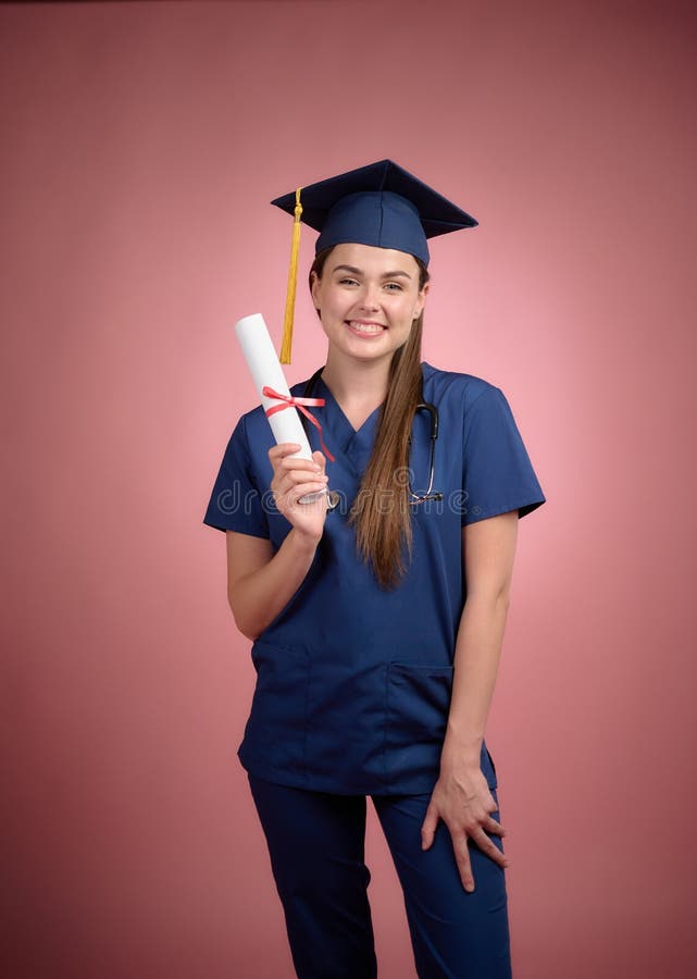 Graduated Nurse in Blue Uniform in Graduation Cap Standing and Holding ...