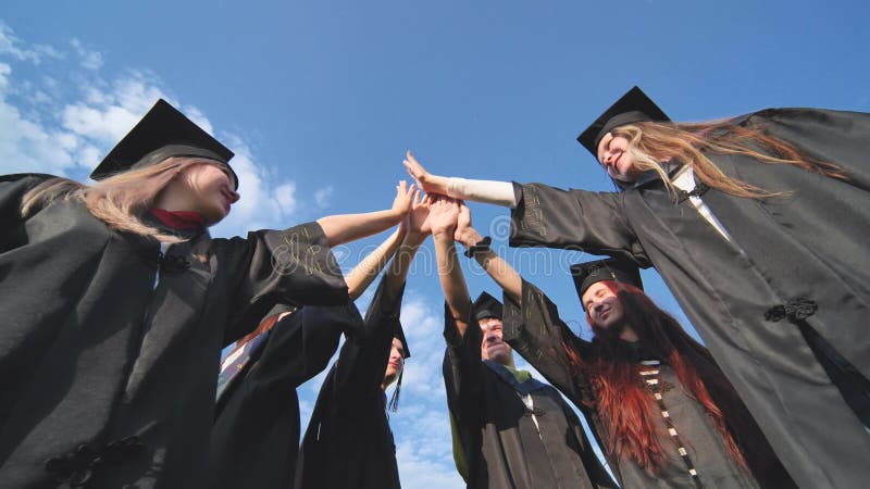 Graduates in Black School Uniforms Join Hands. the Concept of Team and ...