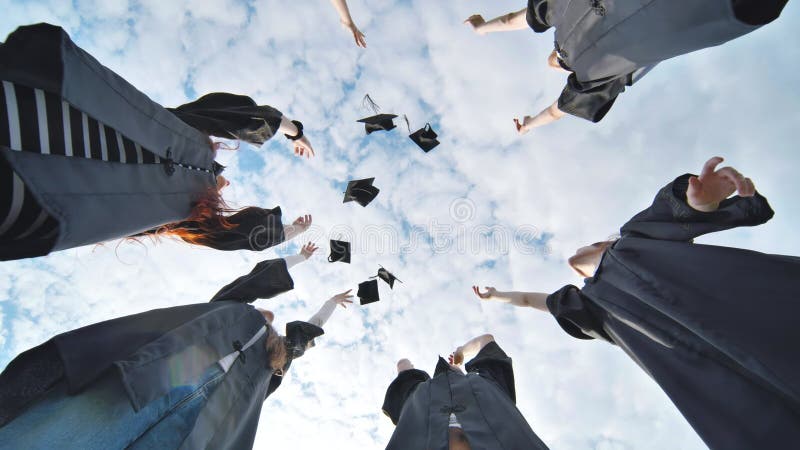 Graduating Students Hands Throwing Graduation Caps in the Air. Stock ...