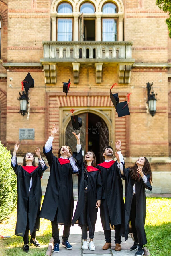 Graduating Students Throwing Caps in the Air at University Ceremony ...