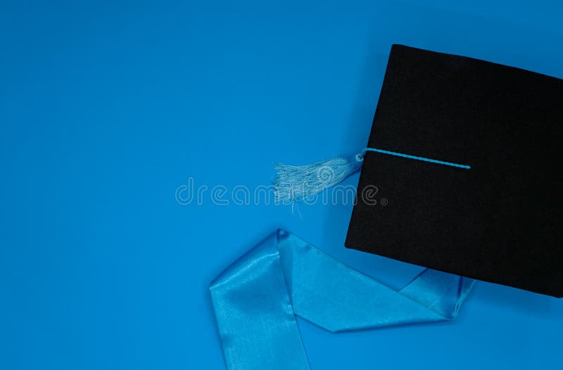 Graduation Cap on Blue Background Stock Photo - Image of gown, happy ...