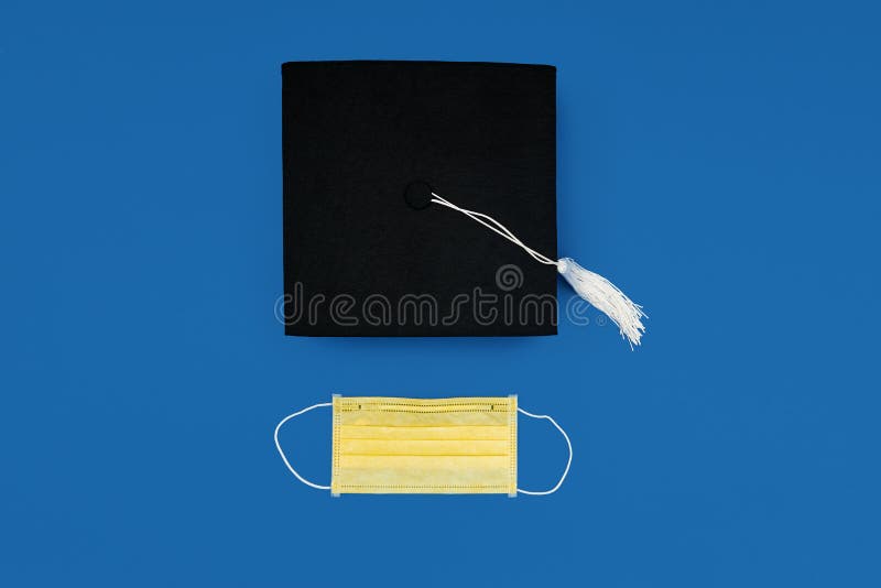Graduation Cap and Face Shield on Blue Stock Photo - Image of ...