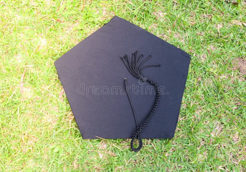 Graduation Cap on Green Grass with Sunlight. Stock Photo - Image of ...