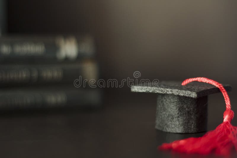 Graduation Cap with Pile of Books on the Background. with Copy Space ...