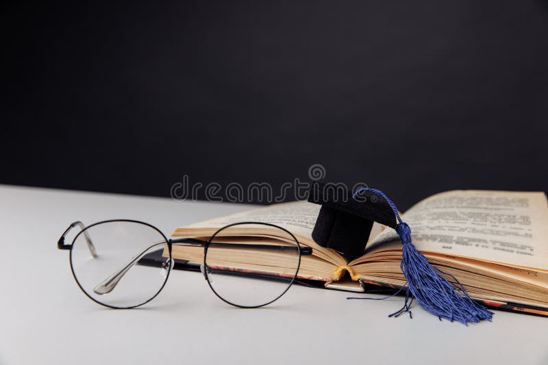 Graduation Cap on a Table. Education Concept Stock Photo - Image of ...