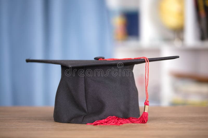 Graduation Cap on the Table Stock Photo - Image of school, season ...