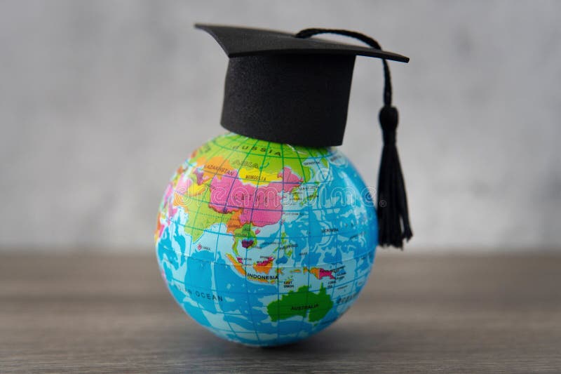 Graduation Cap on Top of World Globe with Copy Space. Stock Image ...