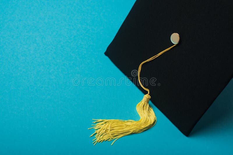 Graduation Cap with Yellow Tassel on Stock Image - Image of yellow ...