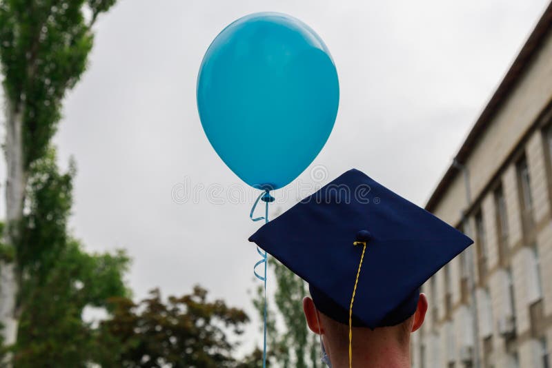 Graduation Day. the Back of a Graduate Wearing Square, Quadrangular ...
