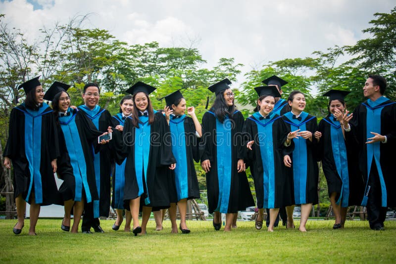 Graduation stock photo. Image of grass, throwing, group - 99709382
