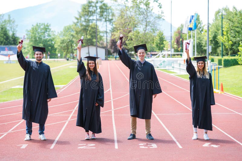 Graduation Group of Students Celebrating on Athletic Track with Stock ...