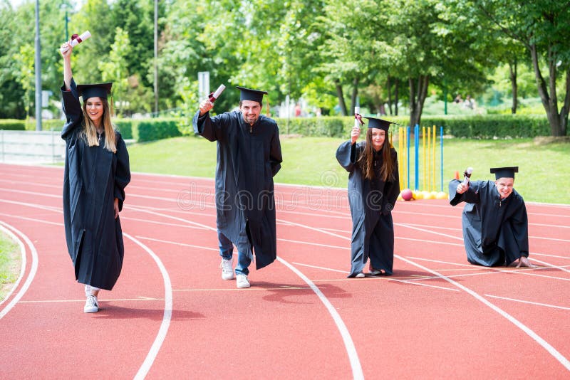 Graduation Day for a Group of Multiracial Graduates Students Posing ...