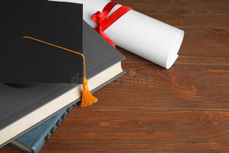Graduation Hat, Books and Student`s Diploma on Table Stock Photo ...