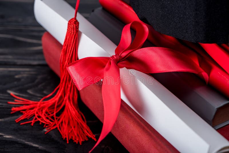 Graduation Hat and Diploma with Red Ribbon on Stack Stock Image - Image ...
