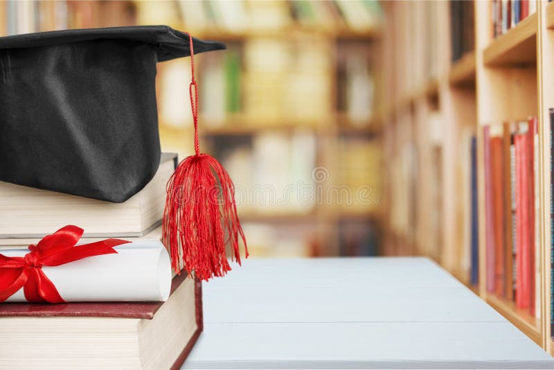Graduation Hat On Stack Of Books And Diploma Stock Photo - Image of ...