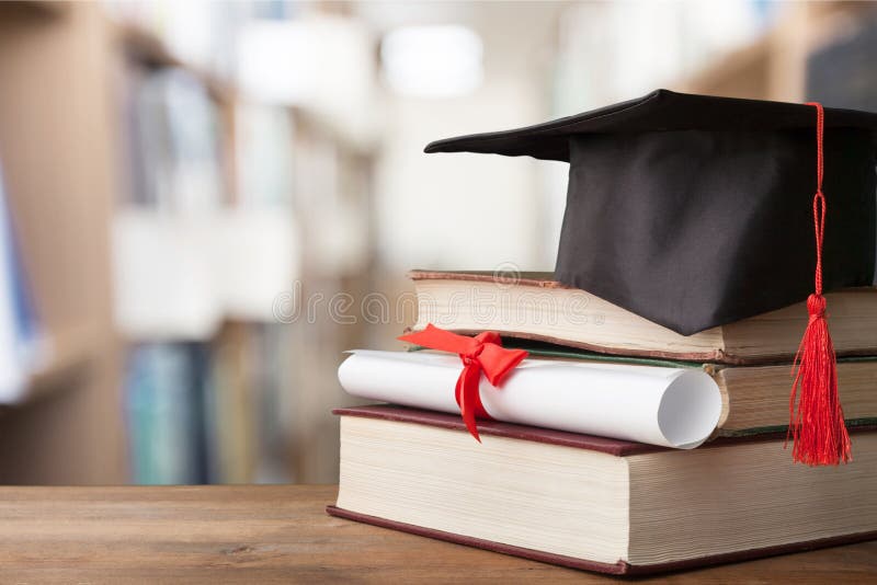 Graduation Hat on Stack of Books on Wooden Table Stock Photo - Image of ...
