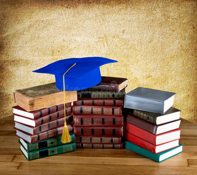 Graduation Mortarboard on Top of Stack of Books Stock Photo - Image of ...