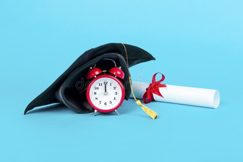 Graduation Cap on Red Clock Near Diploma Stock Photo - Image of ...