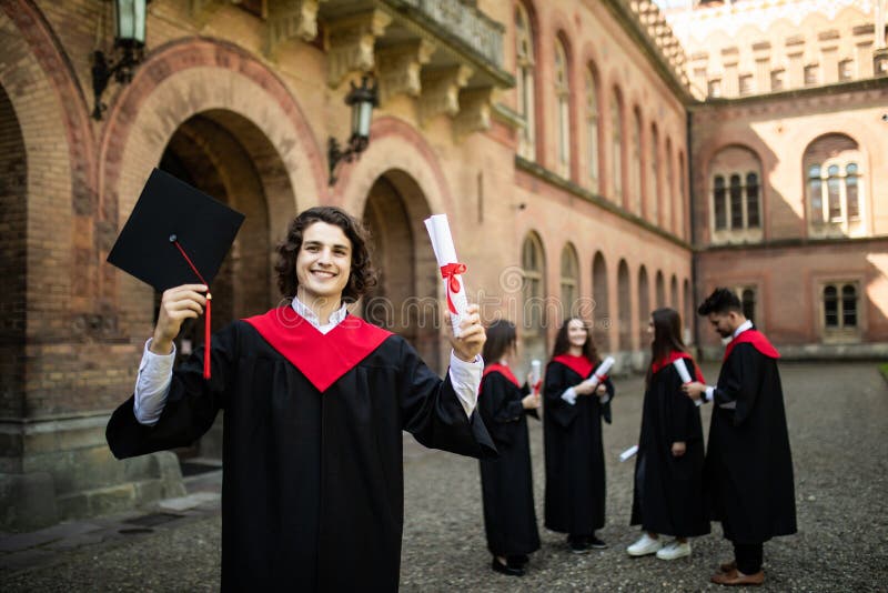 Graduation Young Man in Front of a Group of Graduation Students Stock ...