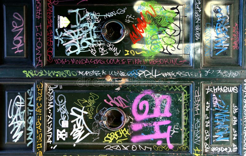 Graffiti art on doors editorial photo. Image of text - 33435551
