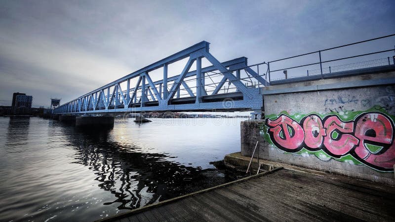 Graffiti Art on a Wall of Railway Bridge Over the Water in Aalborg ...