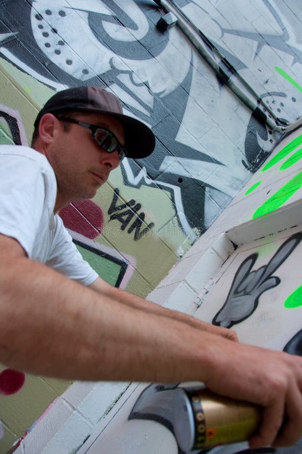 Graffiti Artist at Work on Mural Stock Image - Image of artist, asylum ...