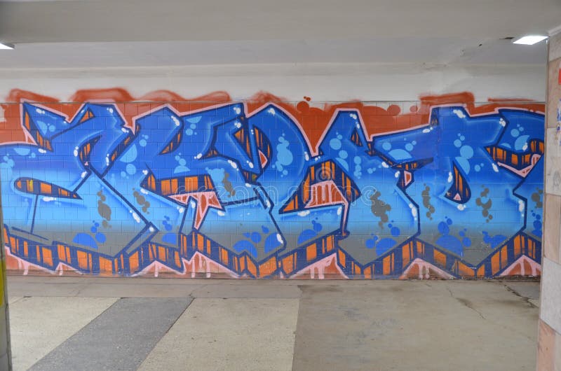 A Graffiti with Blue-red Letters on a Wall Editorial Photography ...
