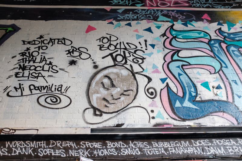 Graffiti on a Brick Wall Features Bold, Colourful Designs and a Face ...