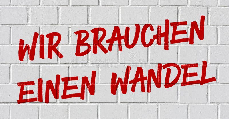 Graffiti on a Brick Wall - we Need a Change Stock Image - Image of ...