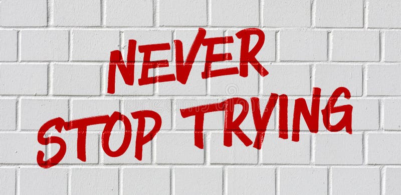 Graffiti on a Brick Wall - Never Stop Trying Stock Image - Image of ...