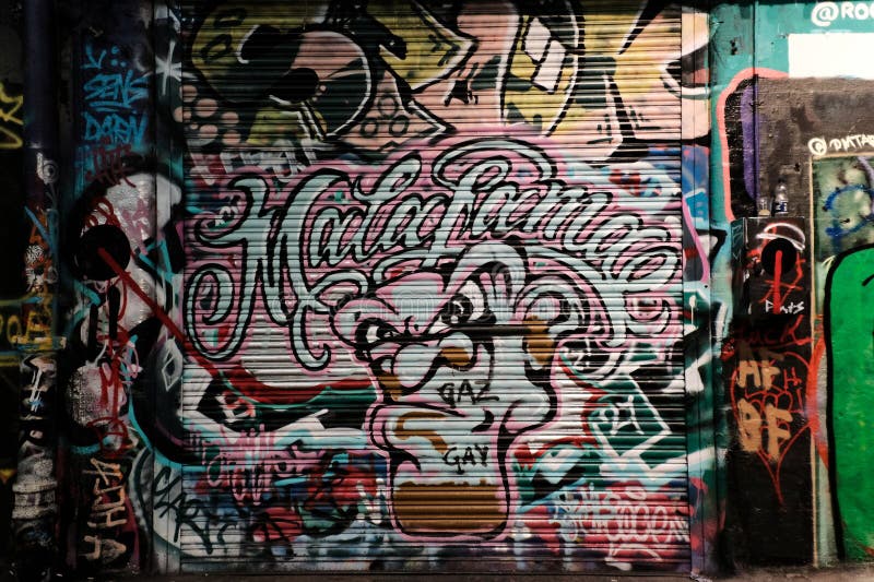 A Very Cool Graffiti of a Man Face Surrounded by Different Colours ...