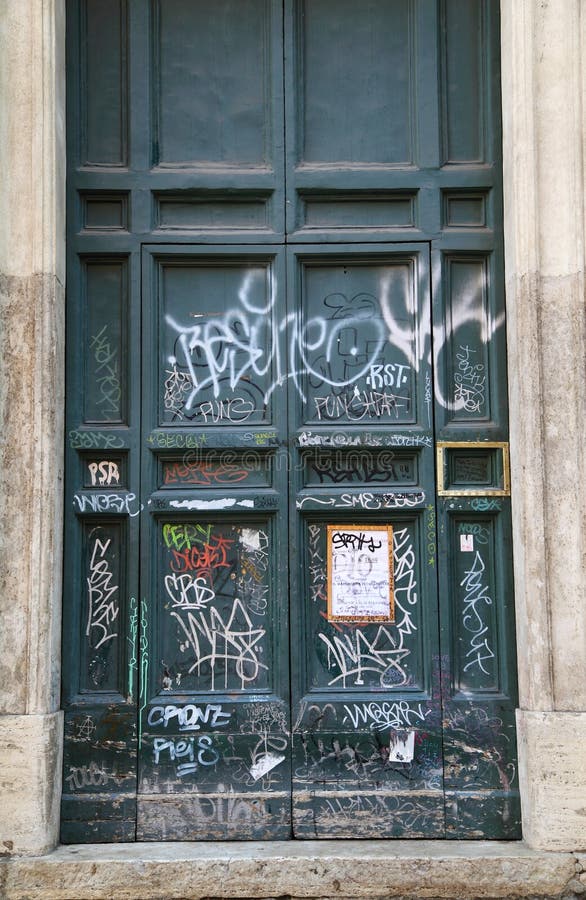 Graffiti Doors in Rome stock photo. Image of writing - 30553596
