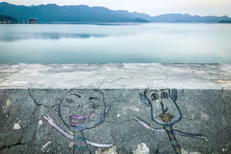 Graffiti on a Water Culvert at a Pond Stock Photo - Image of weed ...