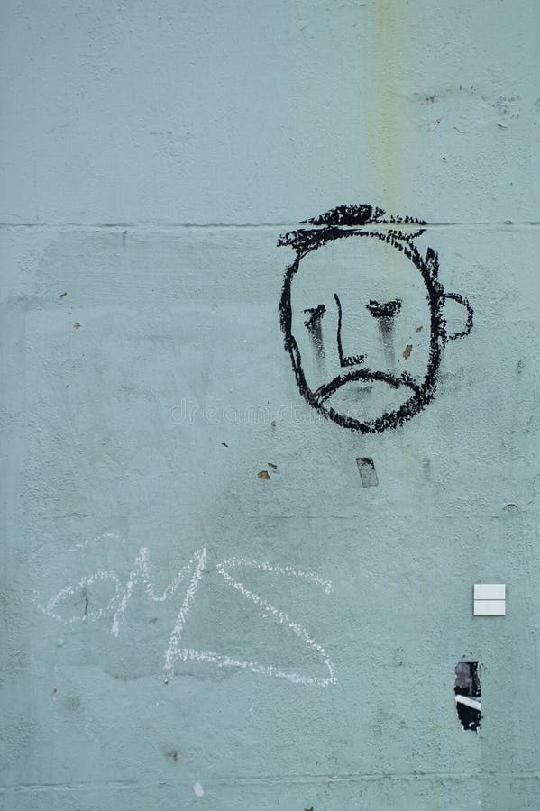 Graffiti, Face of a Sad Looking Man on a Wall Editorial Image - Image ...