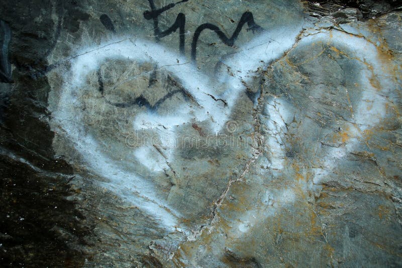 Graffiti Heart on the rock stock photo. Image of crack - 69031370