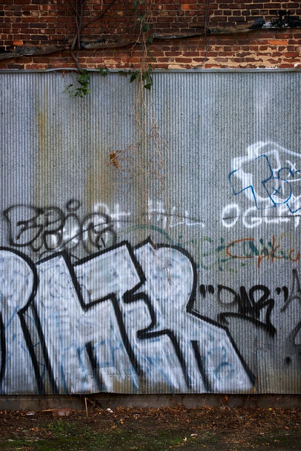 Red Brick Wall with Cross Bones Graffiti Stock Image - Image of walls ...