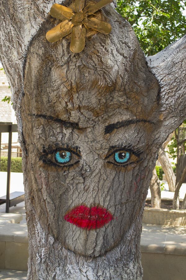 Graffiti of Woman S Face on Tree Stock Image - Image of bright, street ...