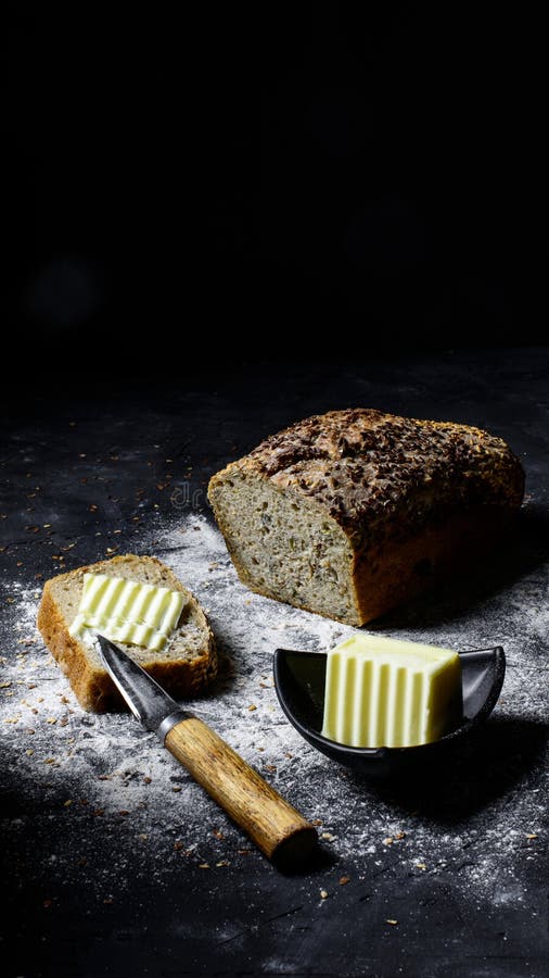 Grain Bread with Butter on a Cutting Board. Stock Image - Image of cutting, background: 309399759