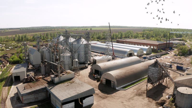 Grain Elevator and Storage Facility in Rural Landscape Stock Photo ...