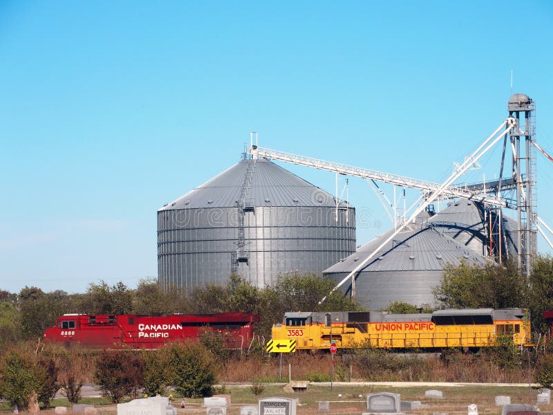Grain Elevator and Train Locomotives Editorial Photography - Image of ...