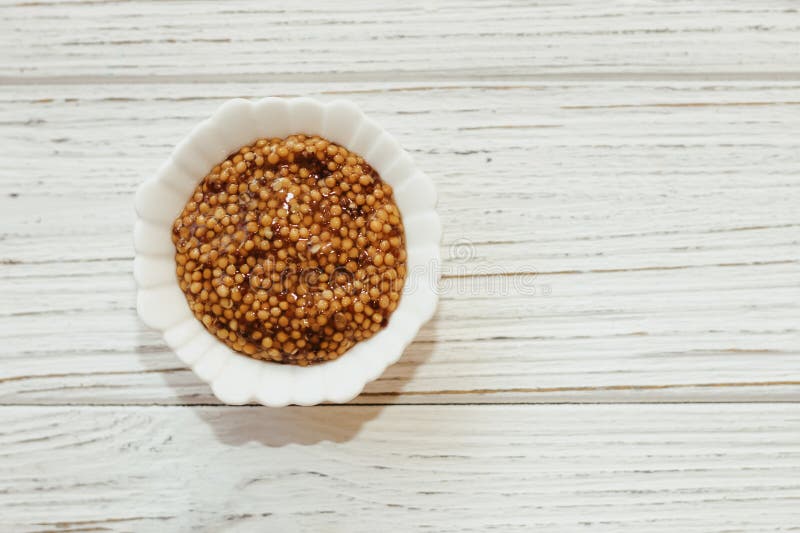 Grain Mustard in a White Bowl on a White Table. Stock Photo - Image of ...