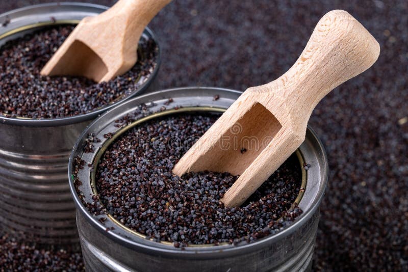 A Grain of Poppy in a Can on a Kitchen Table. Spilled Poppy Seed and ...
