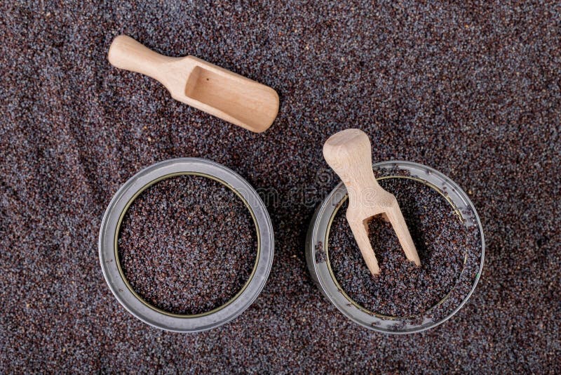 A Grain of Poppy in a Can on a Kitchen Table. Spilled Poppy Seed and ...