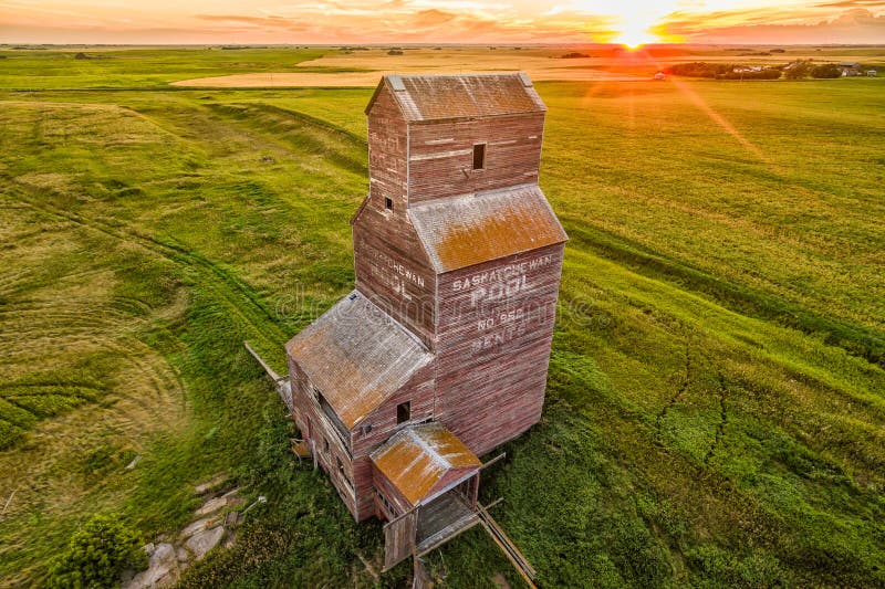 A Grain Silo is in the Middle of a Field Stock Photo - Image of sunrise ...
