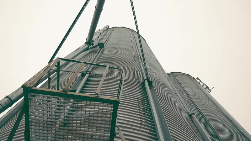 Grain Storage Facility with Metal Structures and Blue Sky. a Modern ...