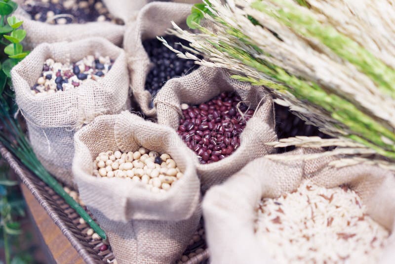 Grains, Beans, Grains and Rice in a Calico Bag on a Wooden Table Stock ...