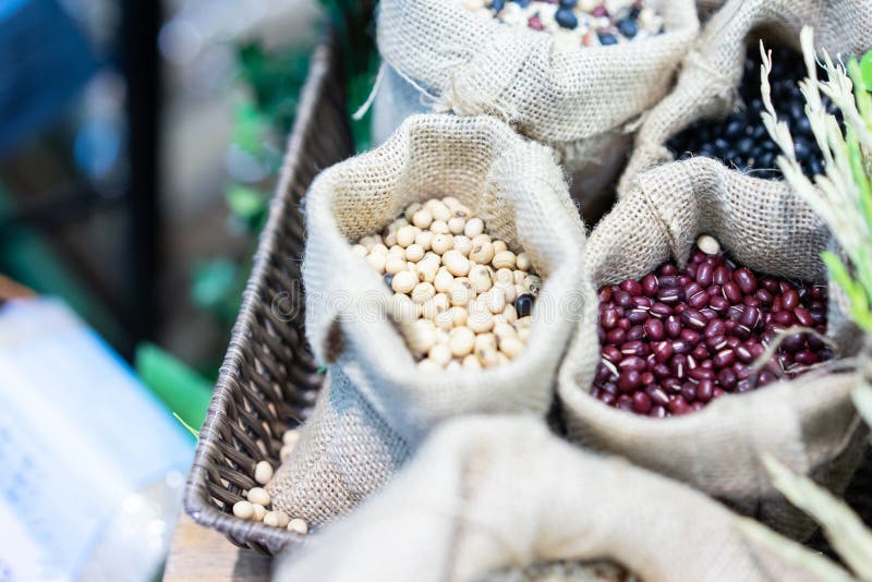 Grains, Beans, Grains and Rice in a Calico Bag on a Wooden Table Stock ...