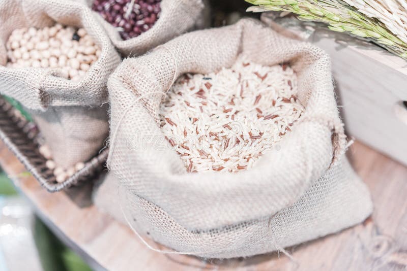 Grains, Beans, Grains and Rice in a Calico Bag on a Wooden Table Stock ...